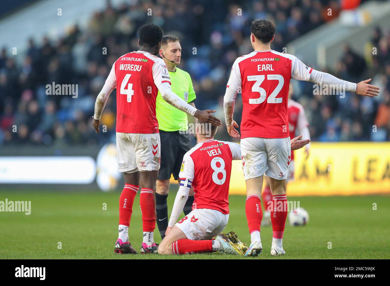 Josh Vela #8 of Fleetwood Town pleads with Referee Simon Mather during ...