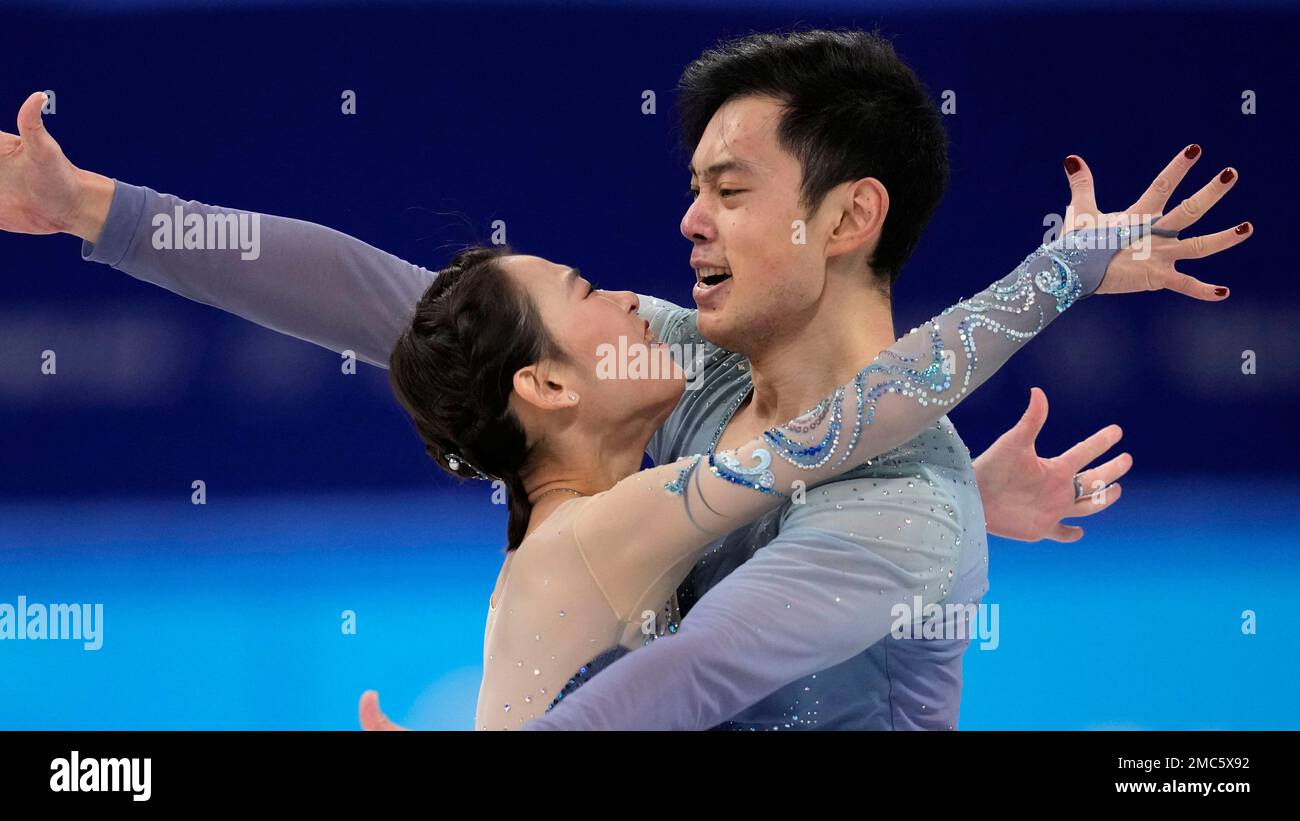 Peng Cheng and Jin Yang, of China, compete in the pairs short program ...