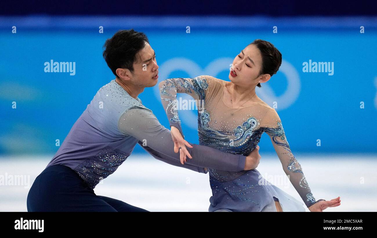Peng Cheng and Jin Yang, of China, compete in the pairs short program ...