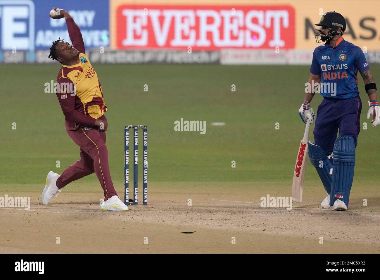 India's Virat Kohli, right, watches as West Indies' Sheldon Cottrell ...