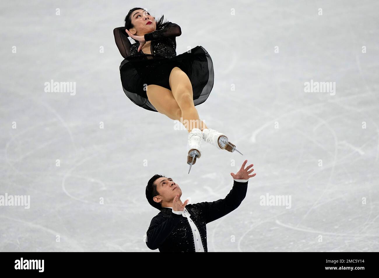 Sui Wenjing and Han Cong, of China, compete in the pairs short program ...