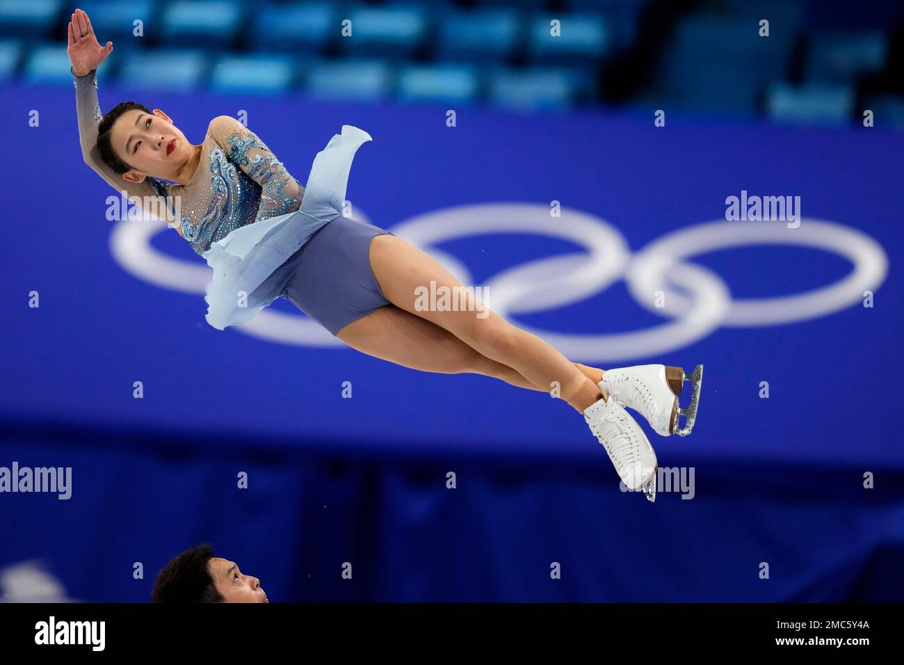 Peng Cheng and Jin Yang, of China, compete in the pairs short program ...