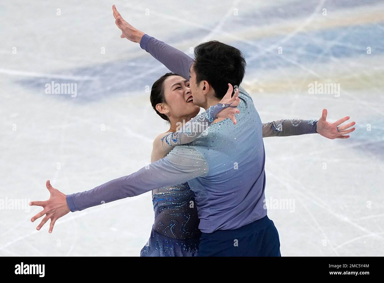 Peng Cheng and Jin Yang, of China, compete in the pairs short program ...