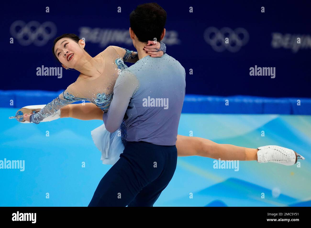 Peng Cheng and Jin Yang, of China, compete in the pairs short program ...