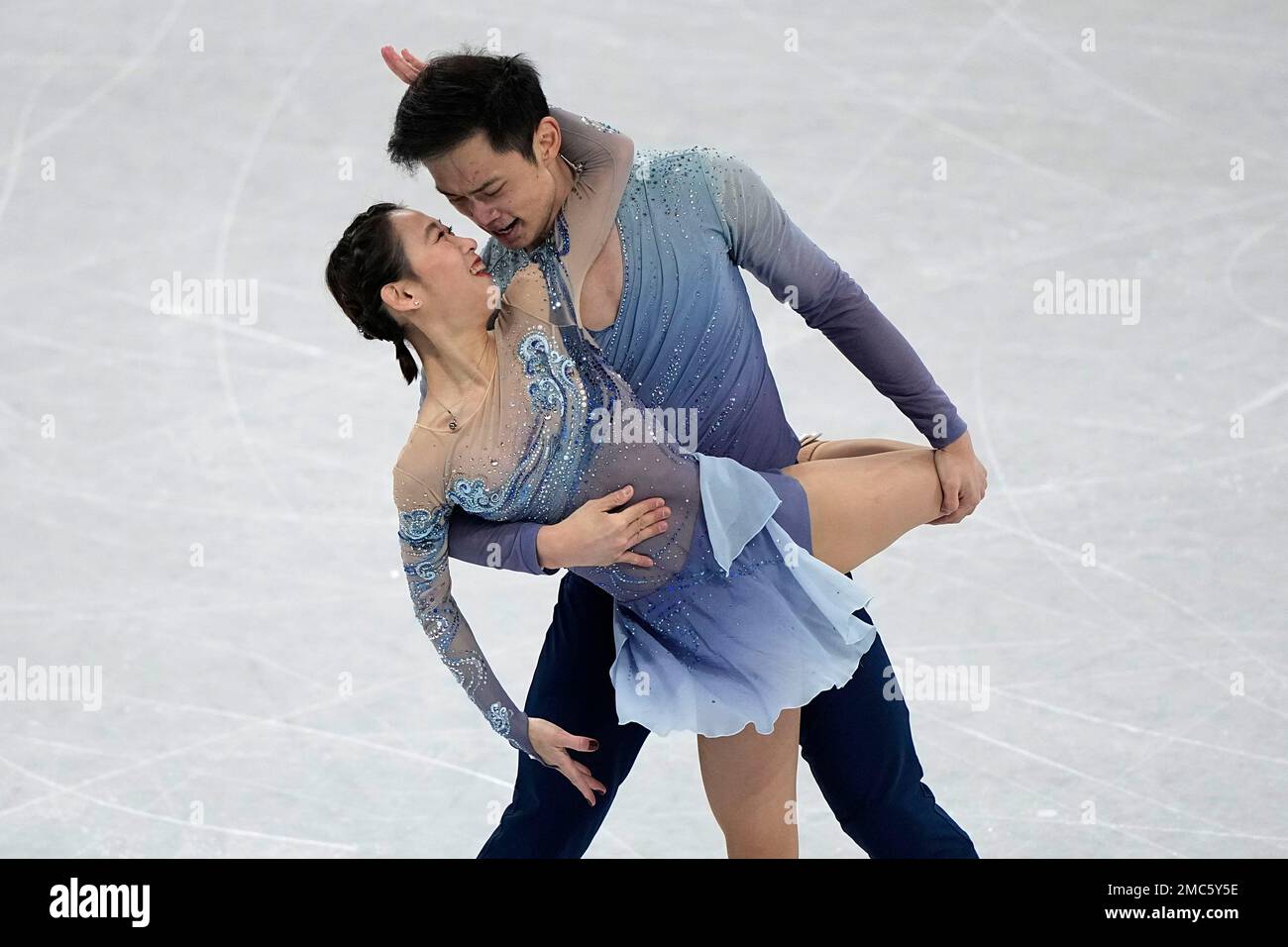 Peng Cheng and Jin Yang, of China, compete in the pairs short program ...