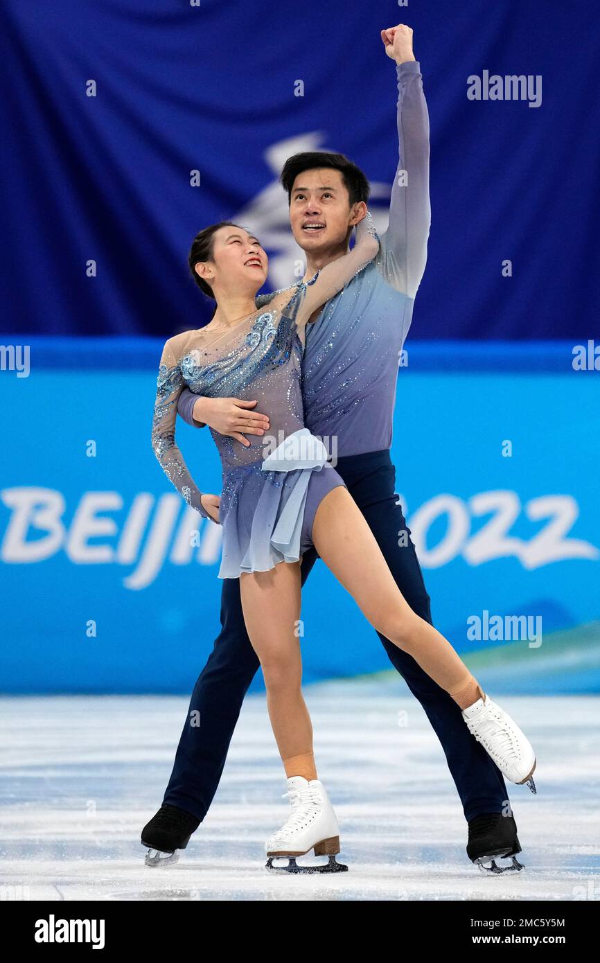 Peng Cheng and Jin Yang, of China, compete in the pairs short program ...