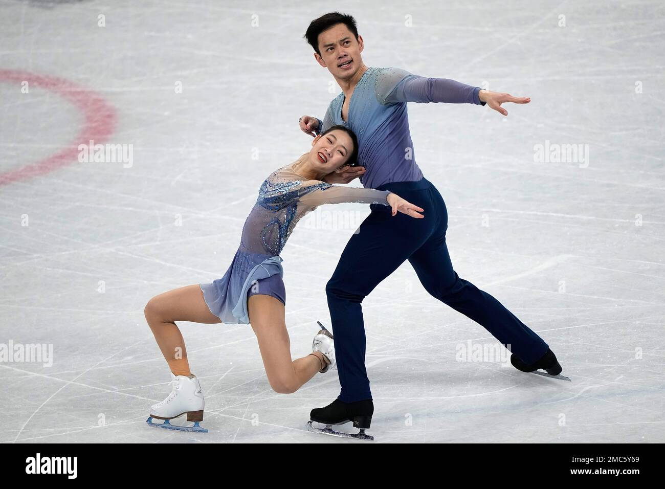 Peng Cheng and Jin Yang, of China, compete in the pairs short program ...