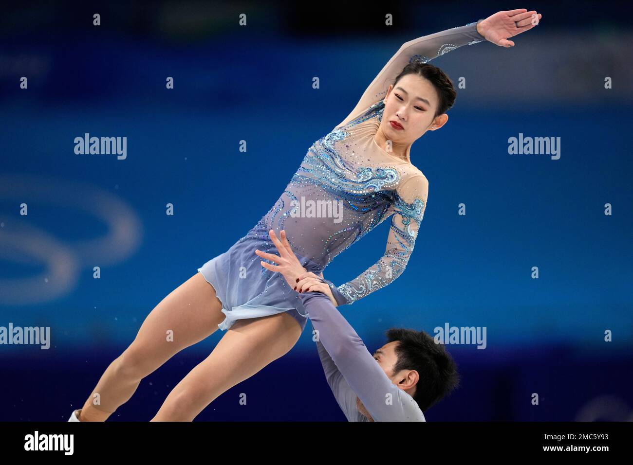 Peng Cheng and Jin Yang, of China, compete in the pairs short program ...