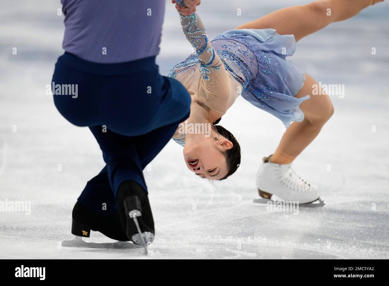 Peng Cheng and Jin Yang, of China, compete in the pairs short program ...