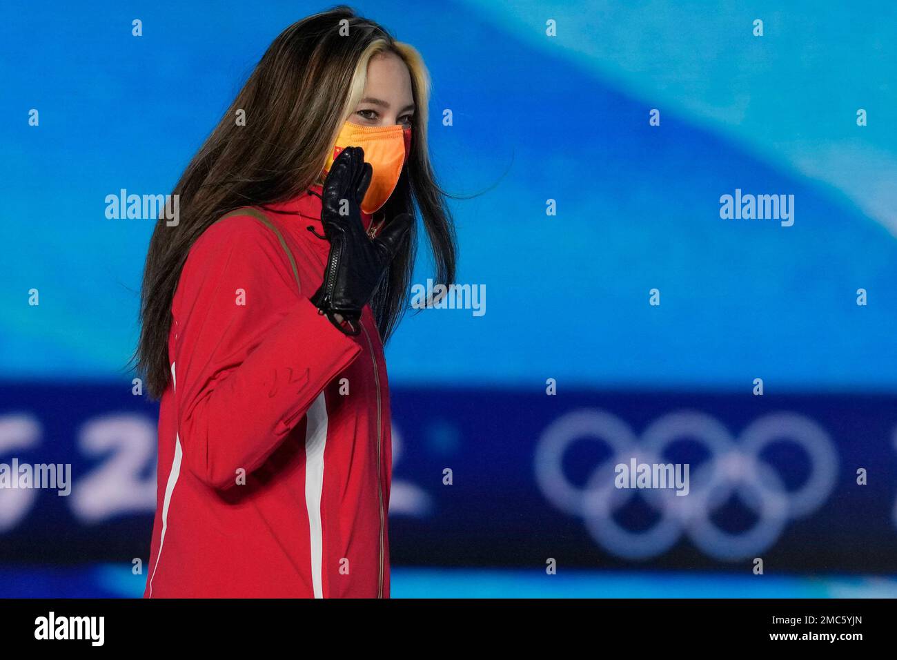 Gold medalist China's Eileen Gu waves during a medal ceremony for the ...