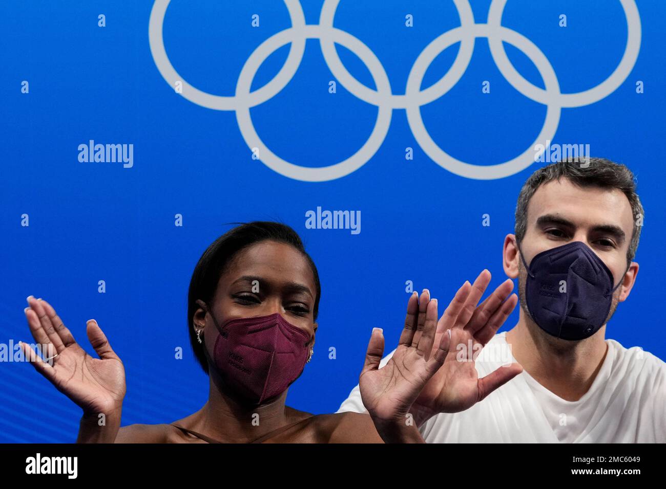 Vanessa James and Eric Radford, of Canada, react after the pairs short ...
