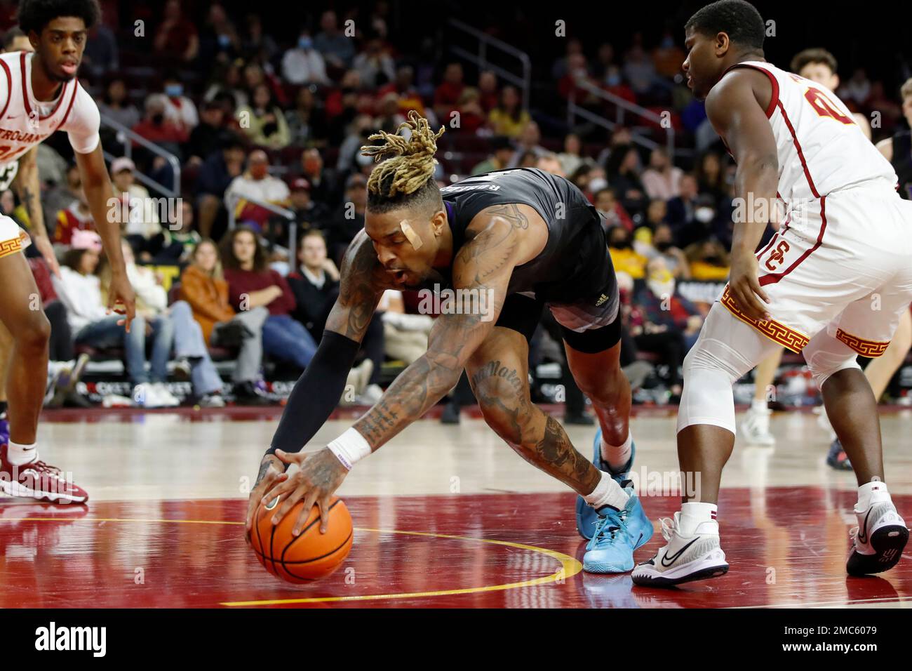 Washington forward Nate Roberts, left, steals the ball away from ...