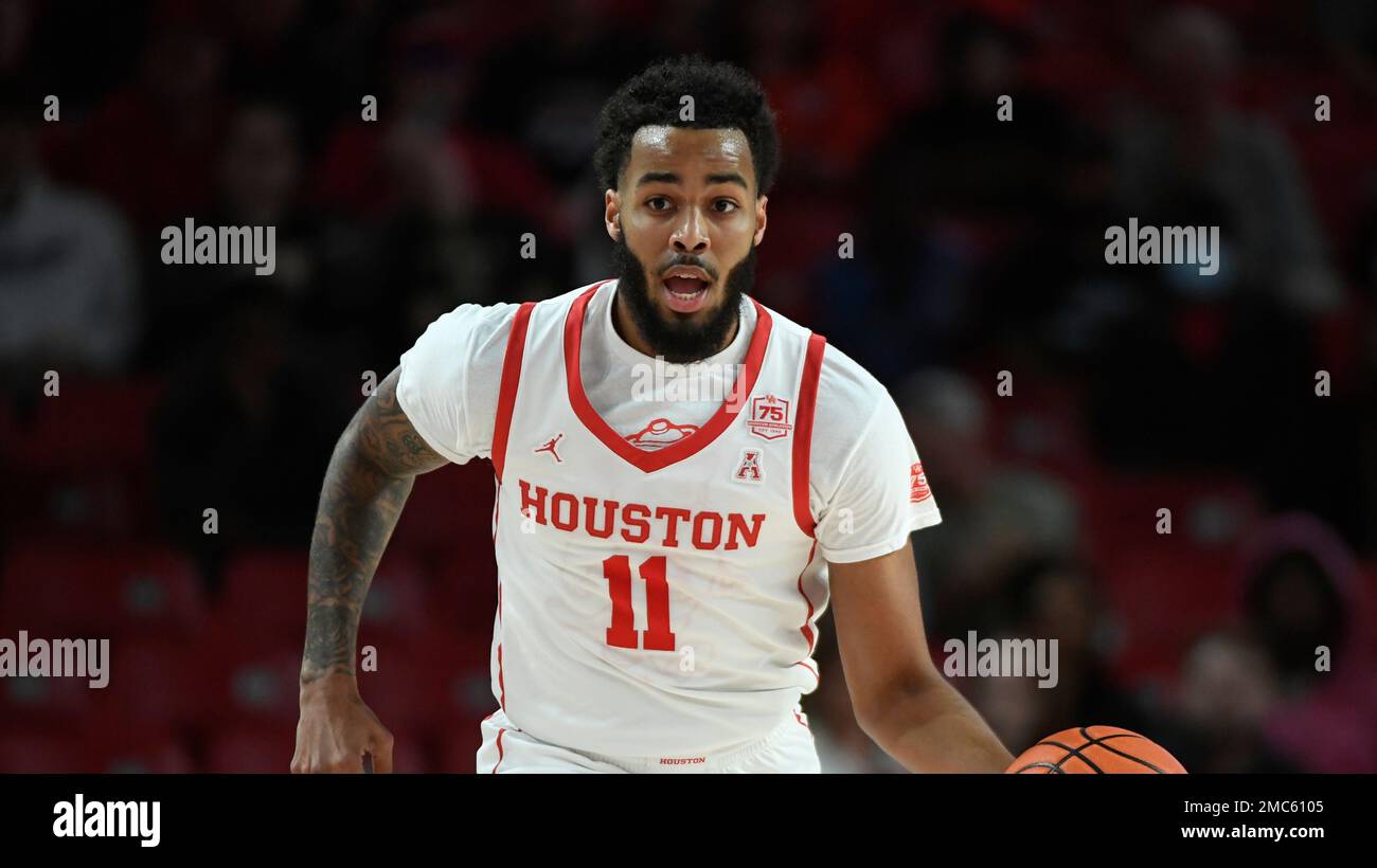 Houston guard Kyler Edwards (11) drives to the basket against Central ...