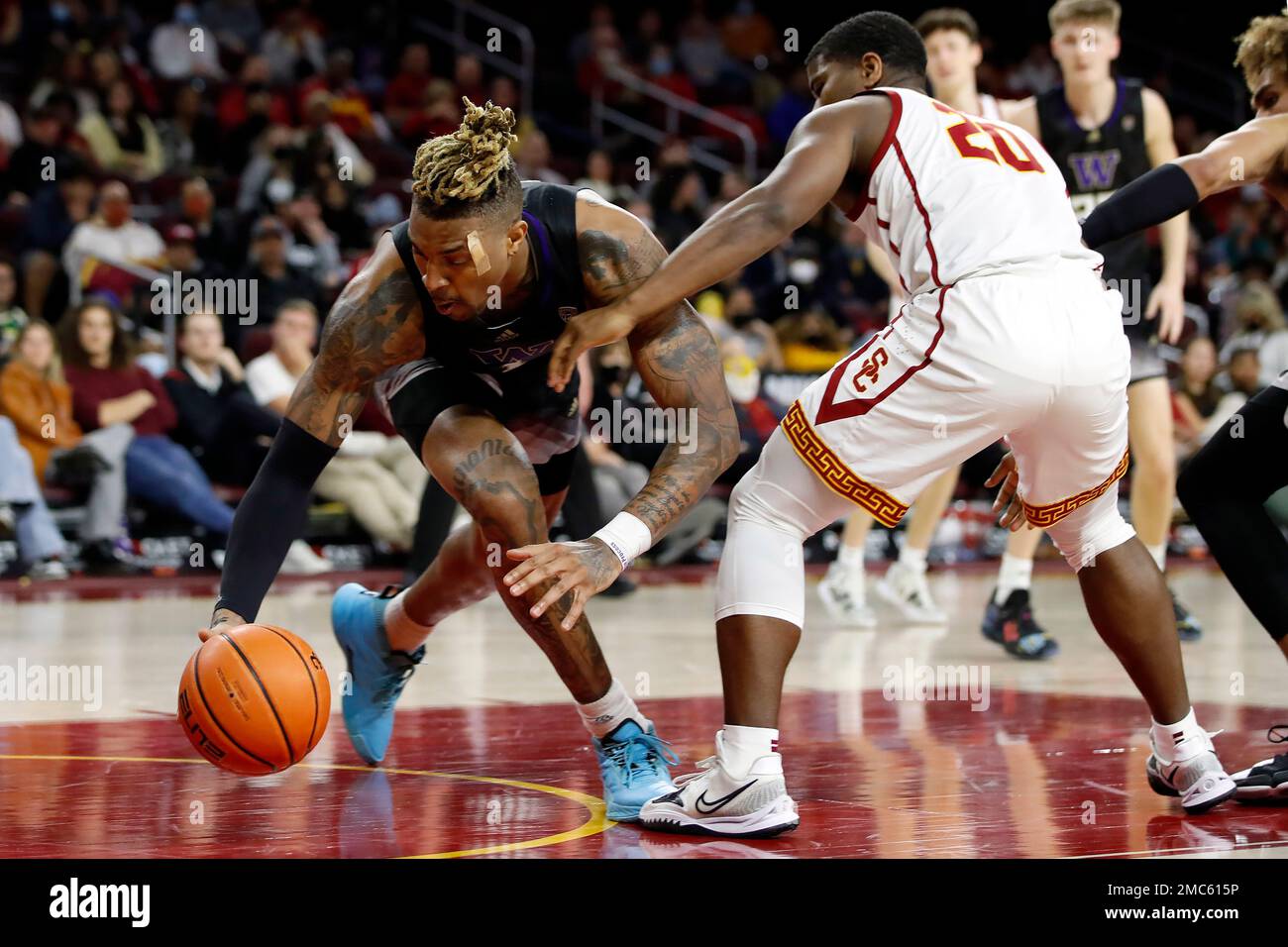 Washington forward Nate Roberts, left, steals the ball from Southern ...