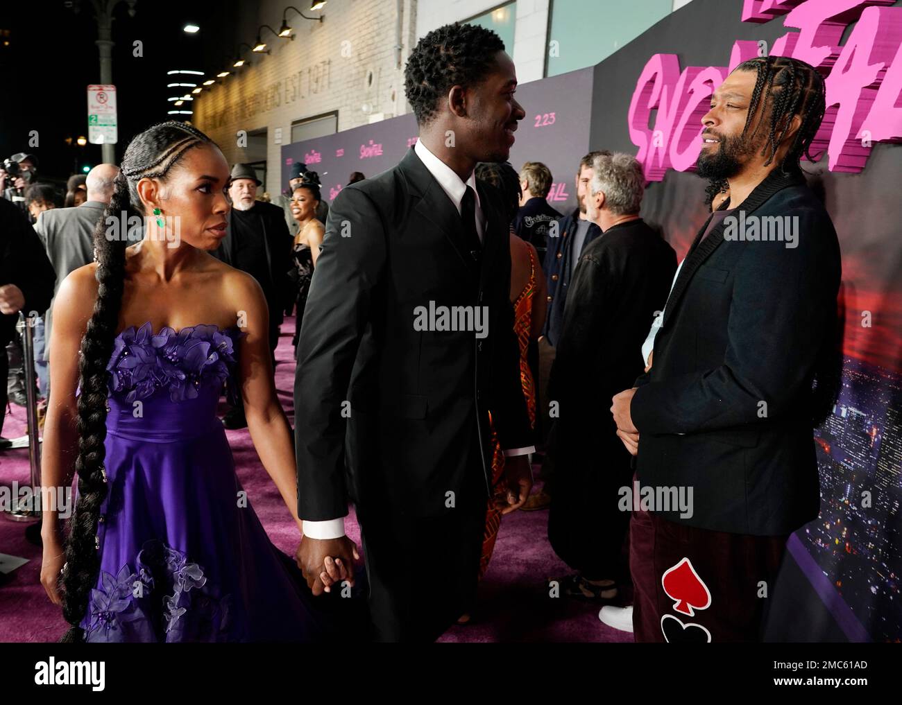 Damson Idris, center, star of "Snowfall," mingles with cast member ...