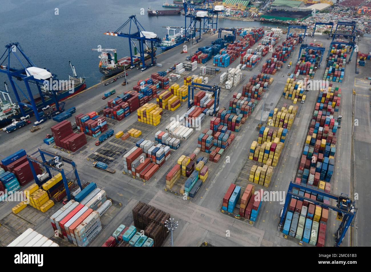 FILE - Stacks of containers line the Manila North Harbour Port, Inc. in ...