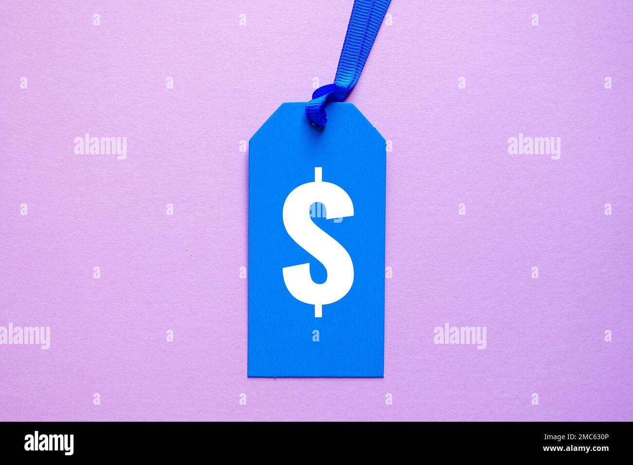 dollar symbol on the blue price tag Stock Photo - Alamy