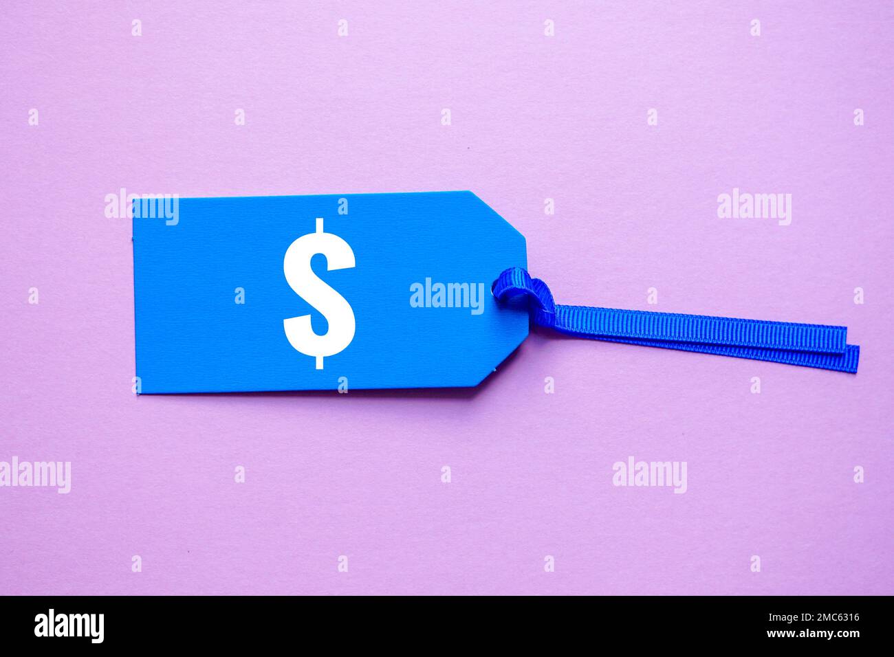 dollar symbol on the blue price tag Stock Photo - Alamy