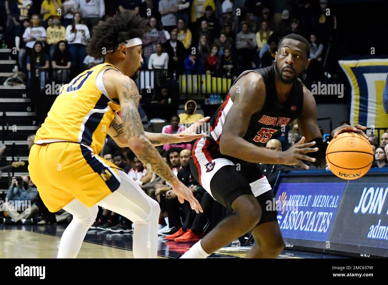 Austin Peay guard Tariq Silver (55) drives against Murray State guard ...