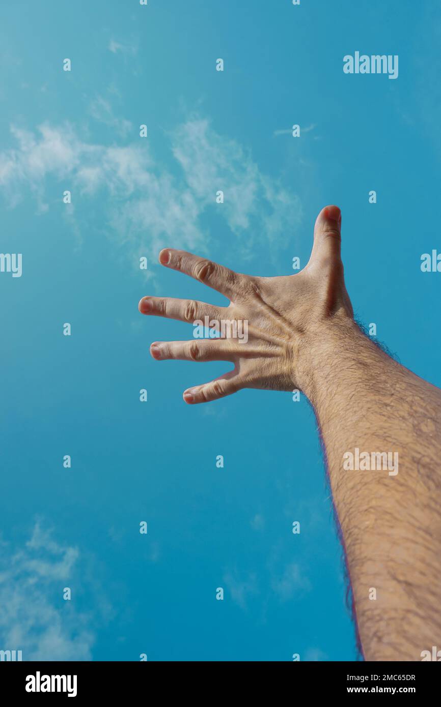 hand up in the air, gesturing in the sky feeling free Stock Photo - Alamy