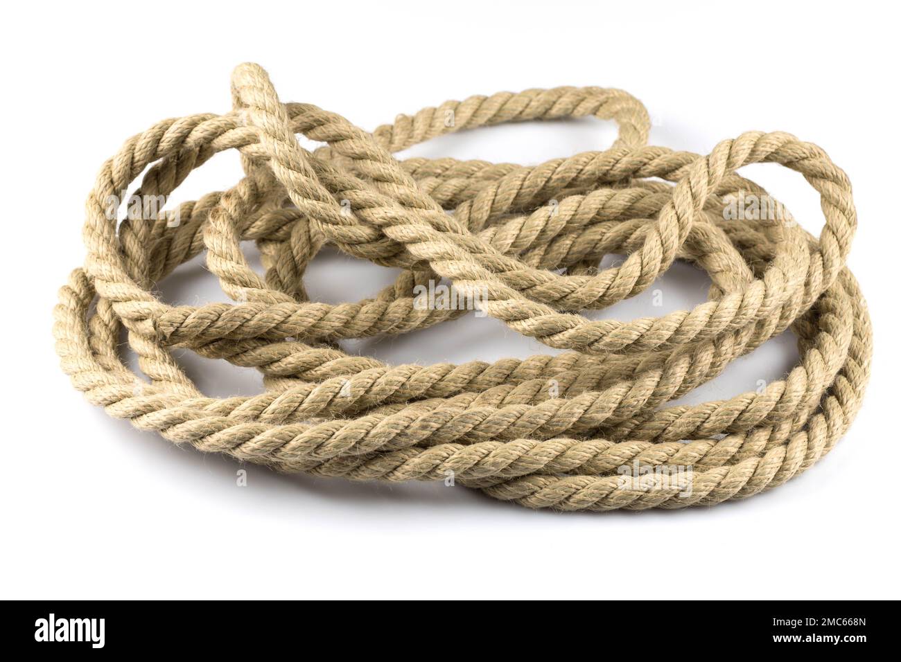 Twisted thick ship ropes with knot isolated background Stock Photo - Alamy