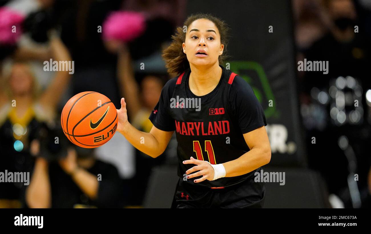 Maryland guard Katie Benzan drives up court during an NCAA college ...