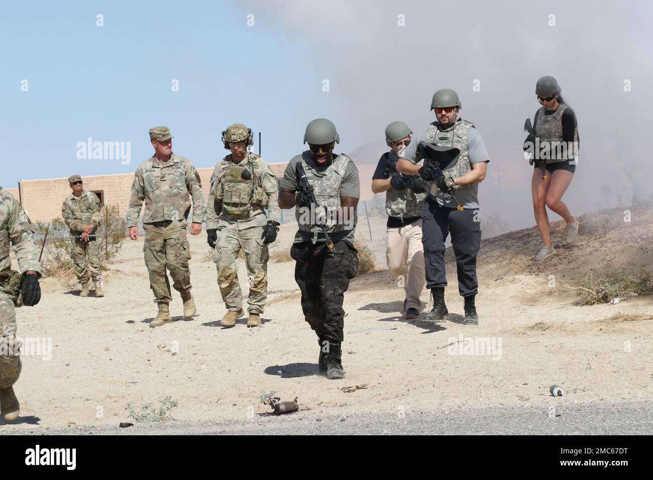 Actor and producer Sheaun McKinney (center) leads a team through a ...