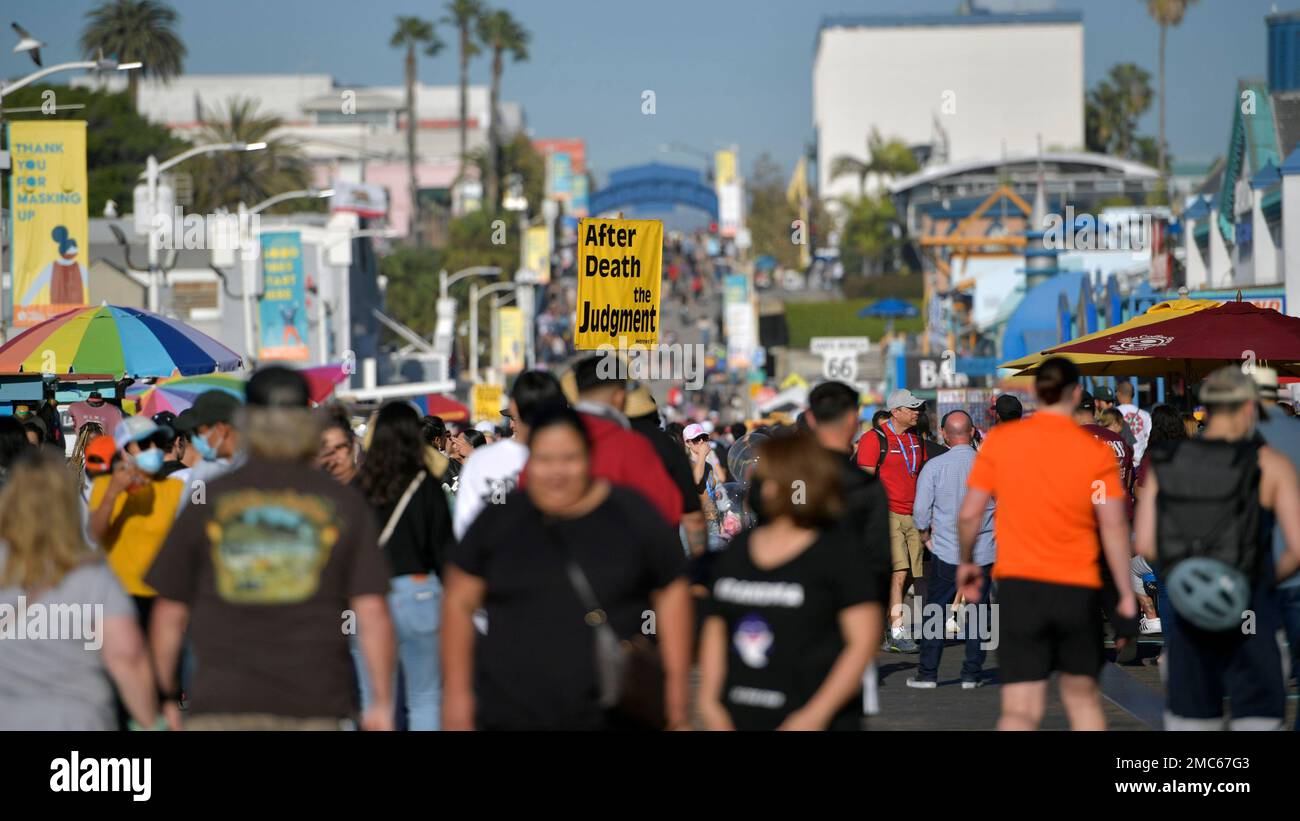 People walk on the pier, Saturday, Feb. 12, 2022, Santa Monica, Calif ...