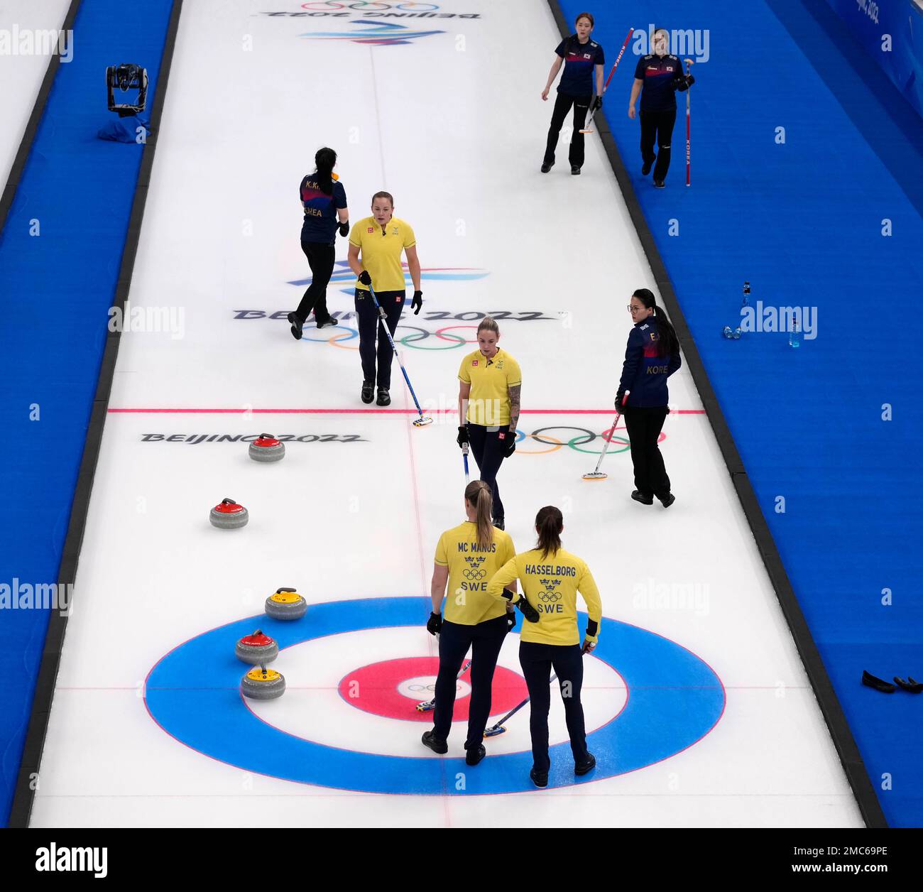 Sweden's team, in yellow, and South Korea's team, compete in the women ...
