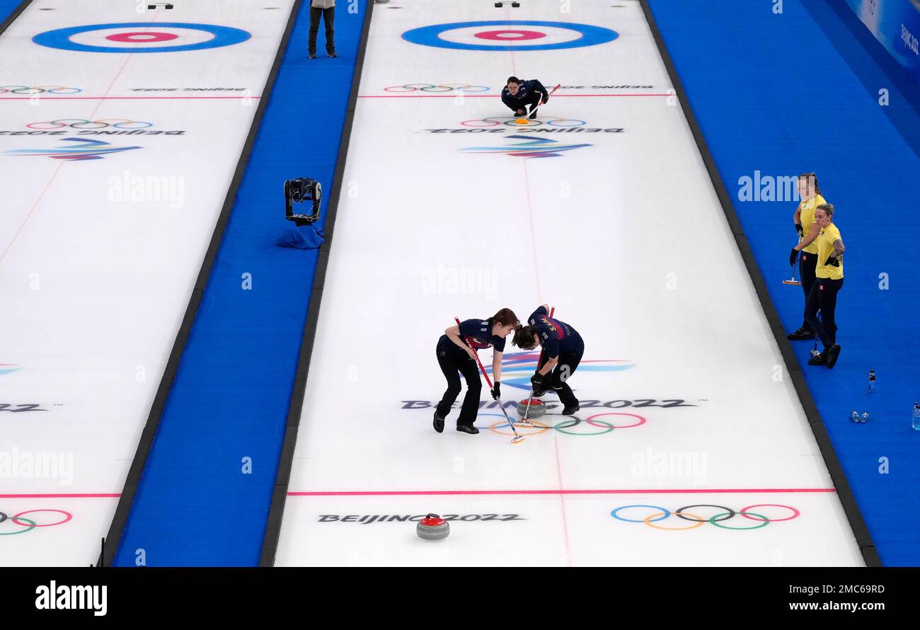Sweden's team, in yellow, and South Korea's team, compete in the women ...