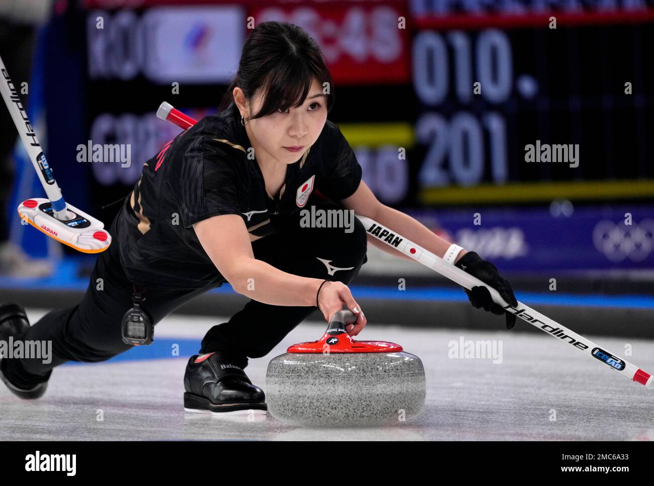 Japan's Yurika Yoshida, throws a rock, during the women's curling match ...