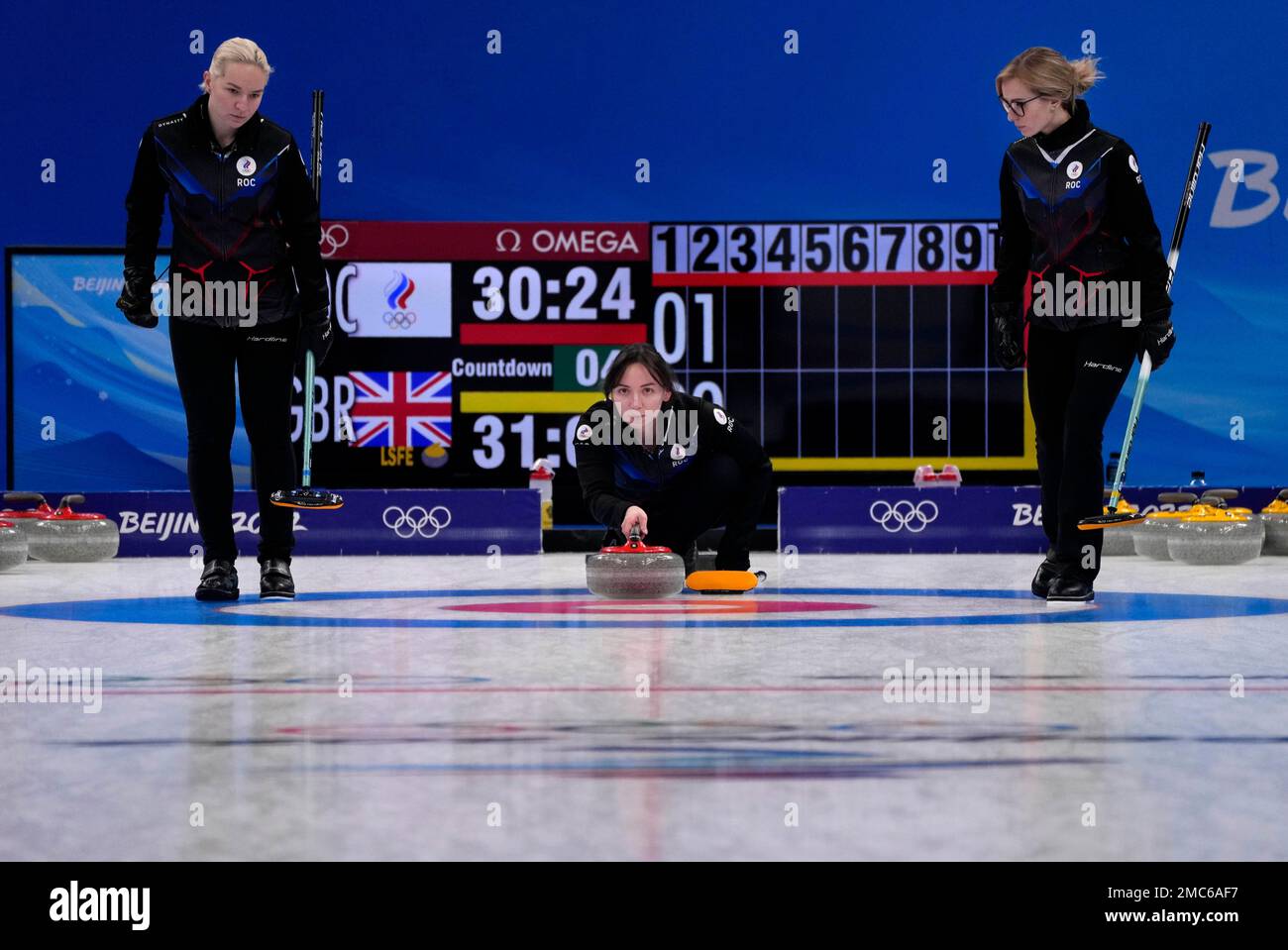 Mariia Komarova of the Russian Olympic Committee, throws a rock, during ...