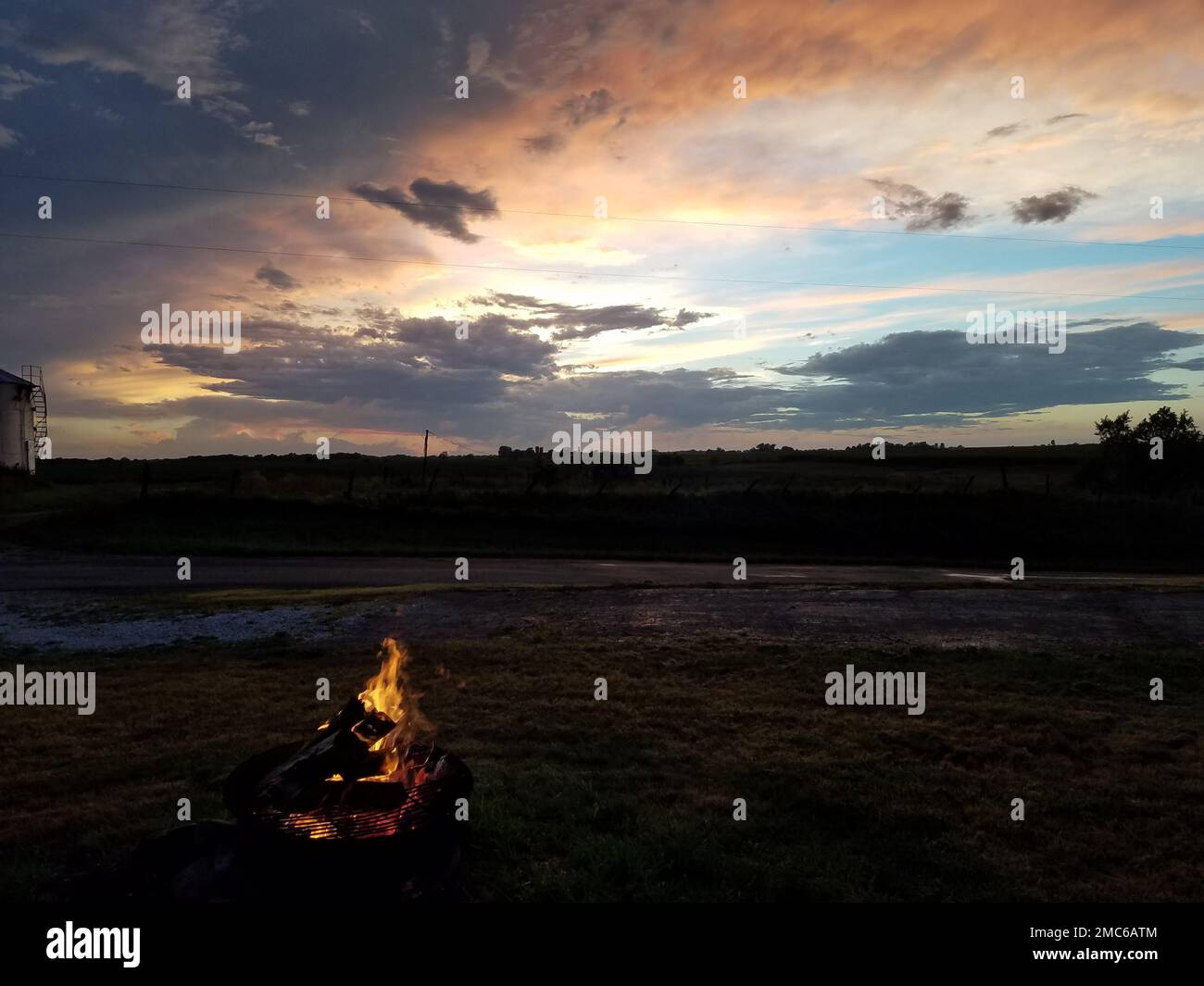 A view of a bonfire in the field at night Stock Photo - Alamy