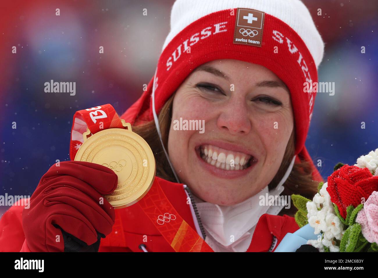 Michelle Gisin of Switzerland celebrates winning the gold medal during ...