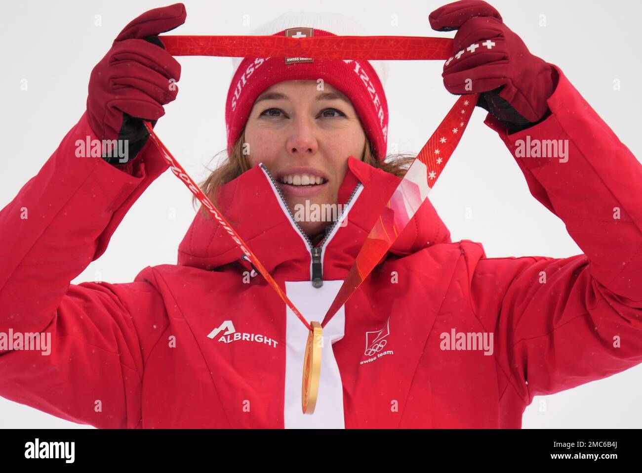 Michelle Gisin of Switzerland prepares to put on her gold medal during ...