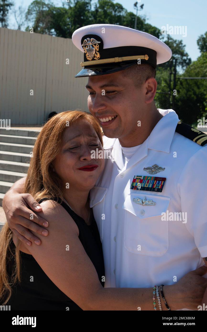 Lt. j.g. Alexis Sandoval hugs his mother during his commissioning ...