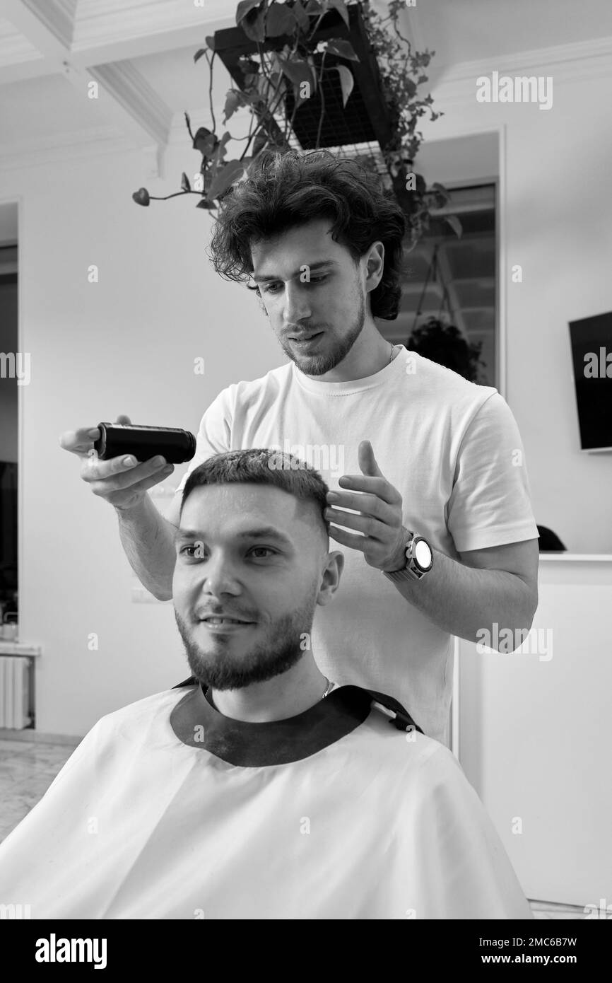 Hairstylist serving barber shop hi-res stock photography and images - Alamy