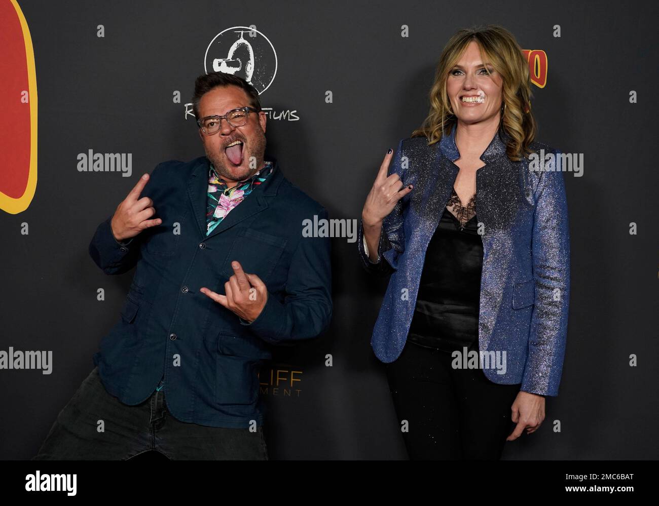 Jeff Buhler, left, and Rebecca Hughes, co-writers of "Studio 666," pose ...