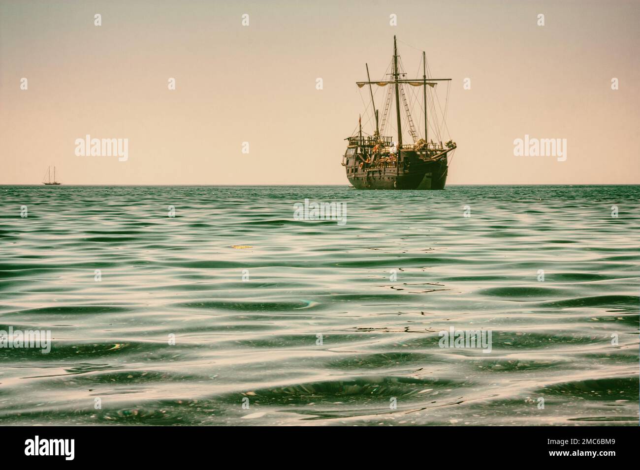 Beautiful seascape - view of morning sea with tourist sightseeing ship ...