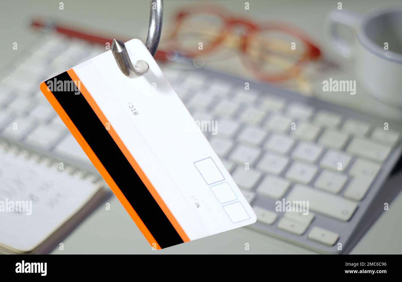 data phishing, big hook with credit card on computer keyboard and ...