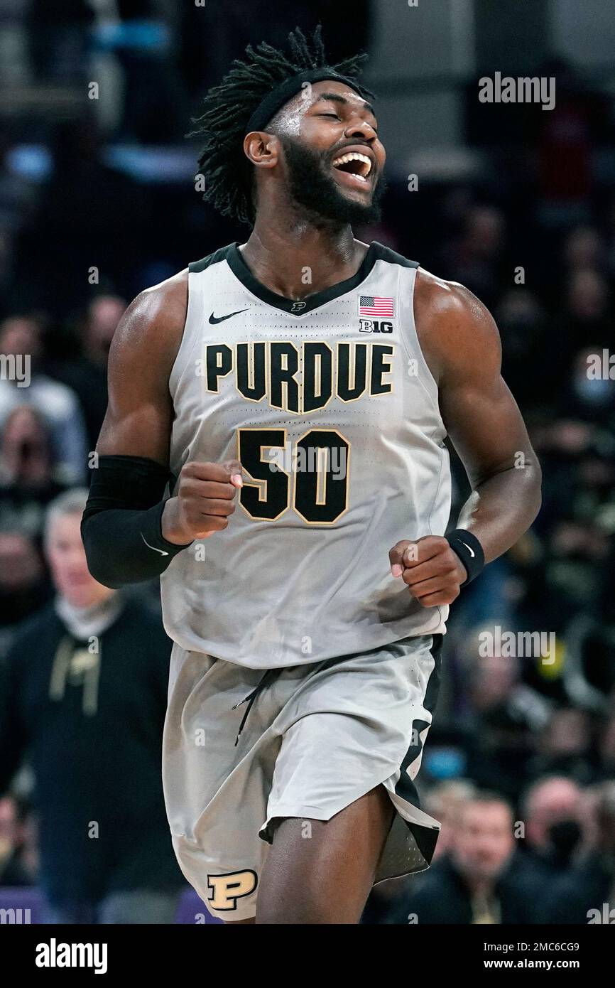 Purdue forward Trevion Williams laughs as he runs on the court during ...