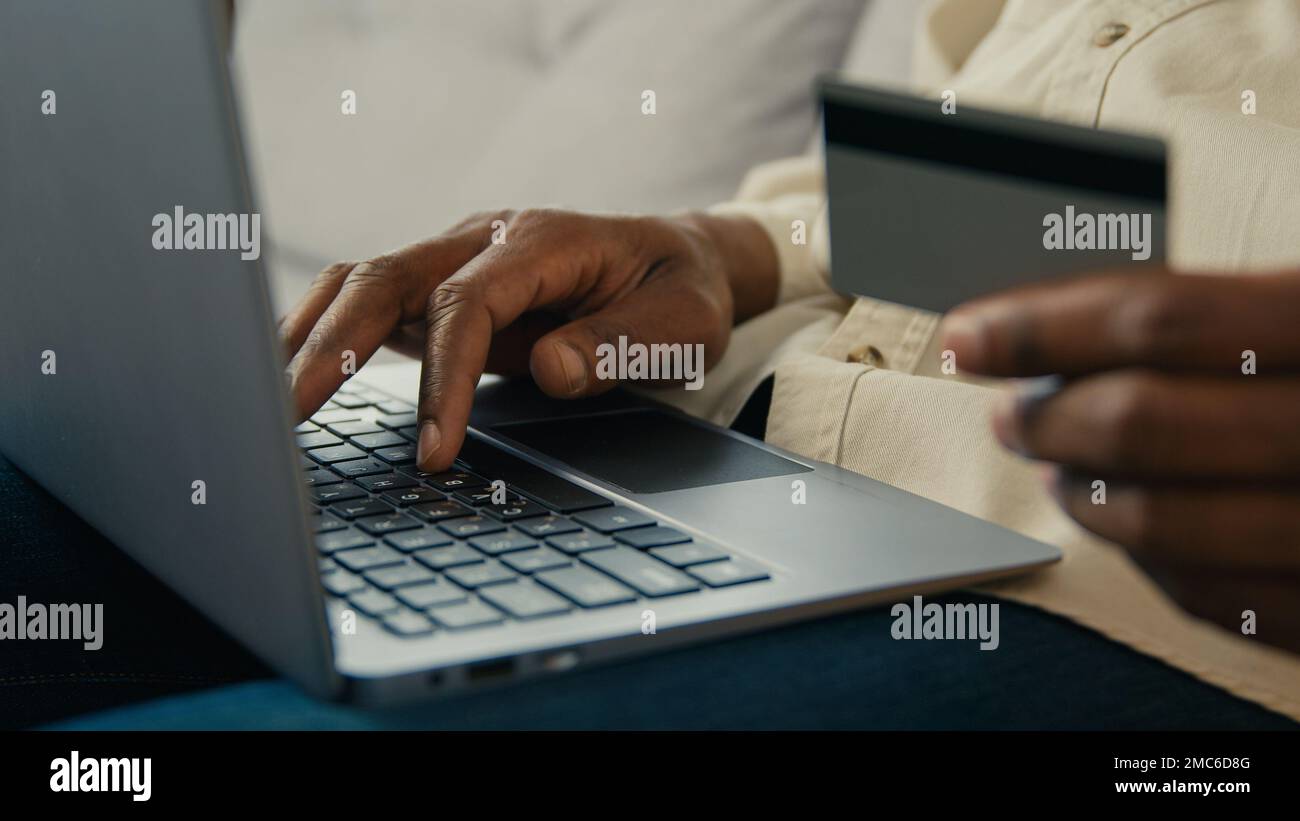 Close-up male hands man customer buyer holding credit card making ...