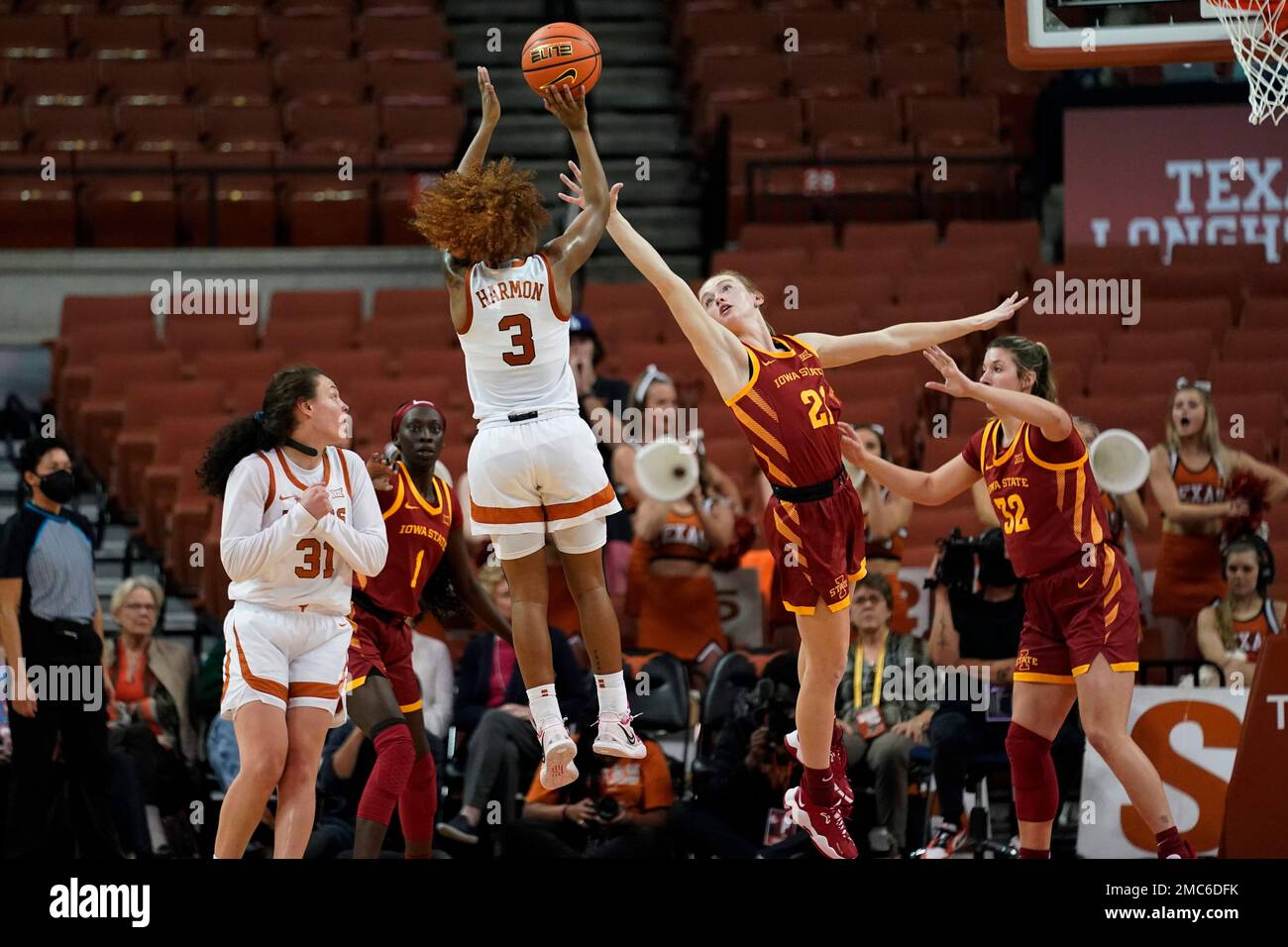 Texas guard Rori Harmon (3) scores over Iowa State guard Lexi Donarski ...