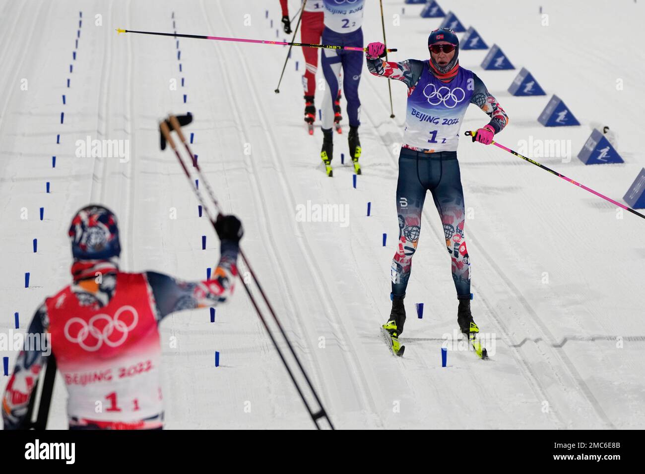 Johannes Hoesflot Klaebo, of Norway, right, celebrates as he nears the ...