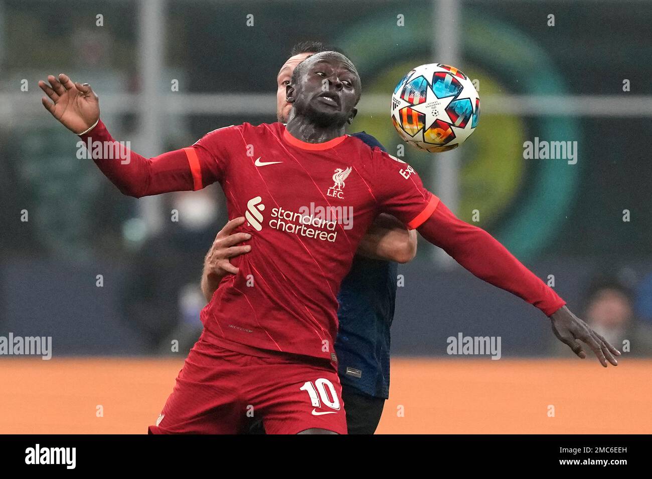 Liverpool's Sadio Mane, foreground, controls the ball past Inter Milan ...