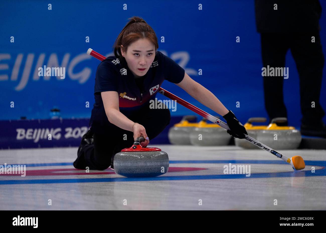 South Korea's Kim Cho-hi, throws a rock, during the women's curling ...