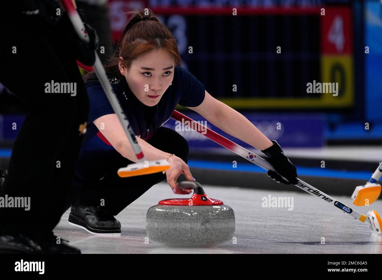 South Korea's Kim Cho-hi, throws a rock, during the women's curling ...