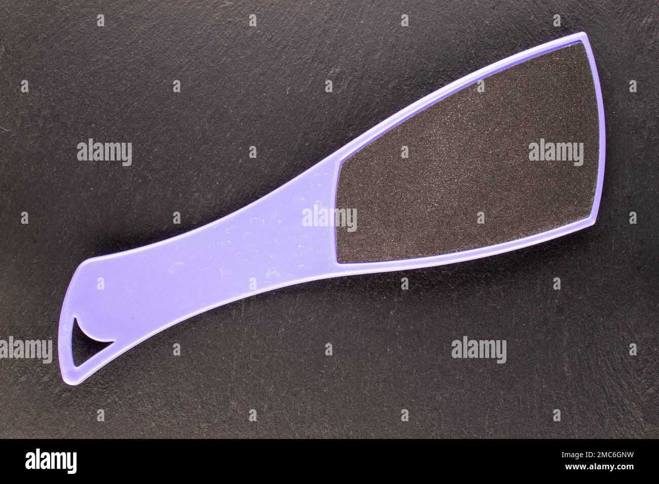 Grinding foot saw on slate stone, macro, top view Stock Photo - Alamy