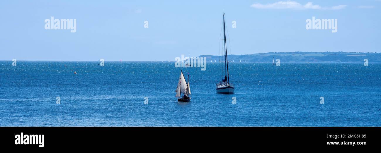 Two sailing float on the sea at St Mawes, Cornwall UK Stock Photo - Alamy