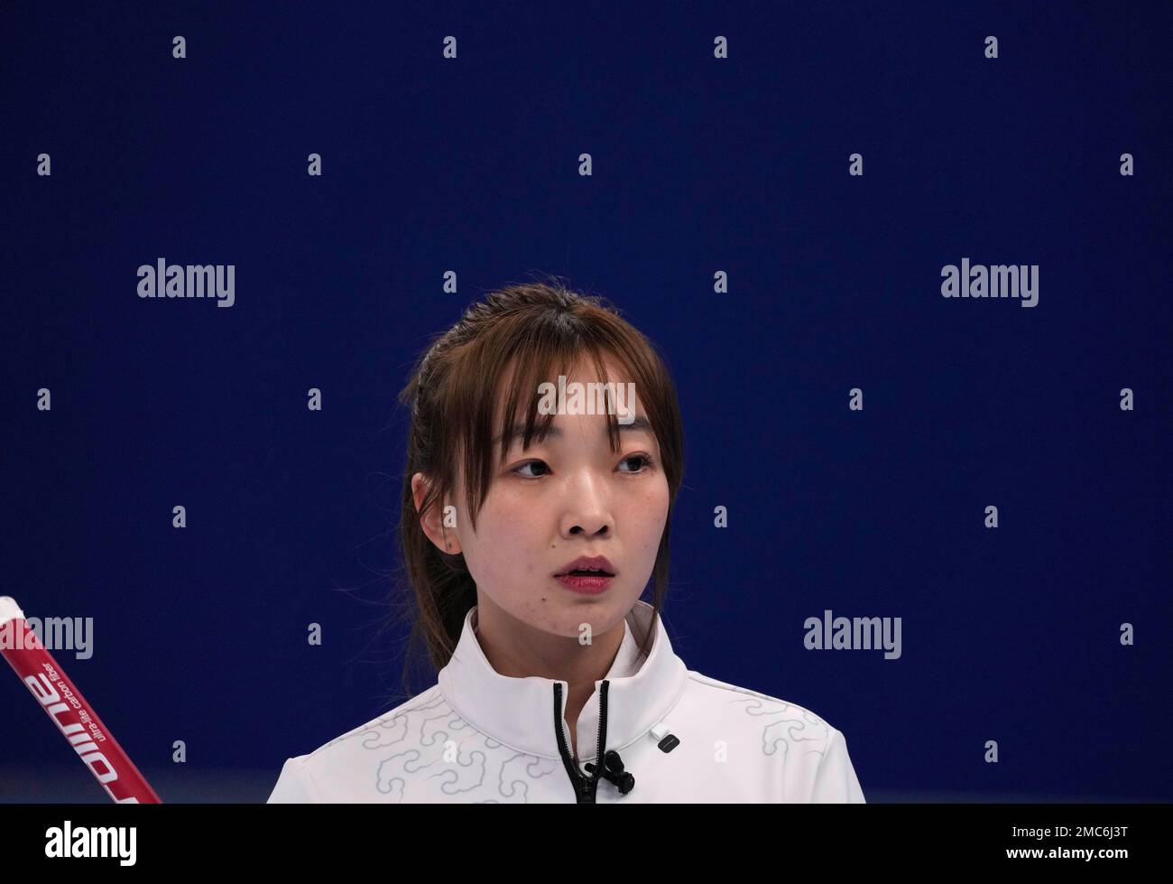 China's Jiang Xindi, competes, during the women's curling match against ...